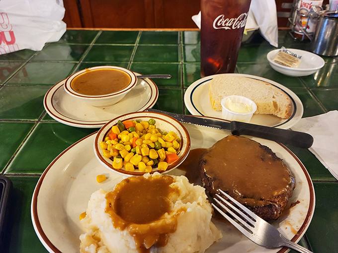 Hamburger steak with mashed potatoes: comfort food that hugs you from the inside out.