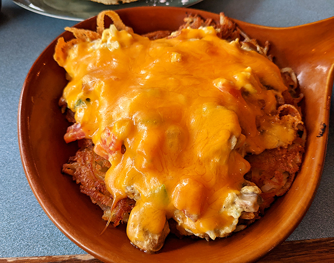 Golden hash browns cascade like crispy treasure, each bite delivering that perfect crunch-to-fluff ratio.