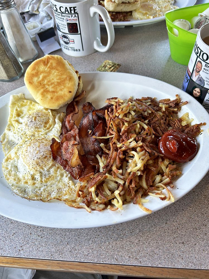 Breakfast of champions: eggs, crispy bacon, and hash browns that look like they've been kissed by the morning sun. That biscuit isn't just a side&mdash;it's an event.
