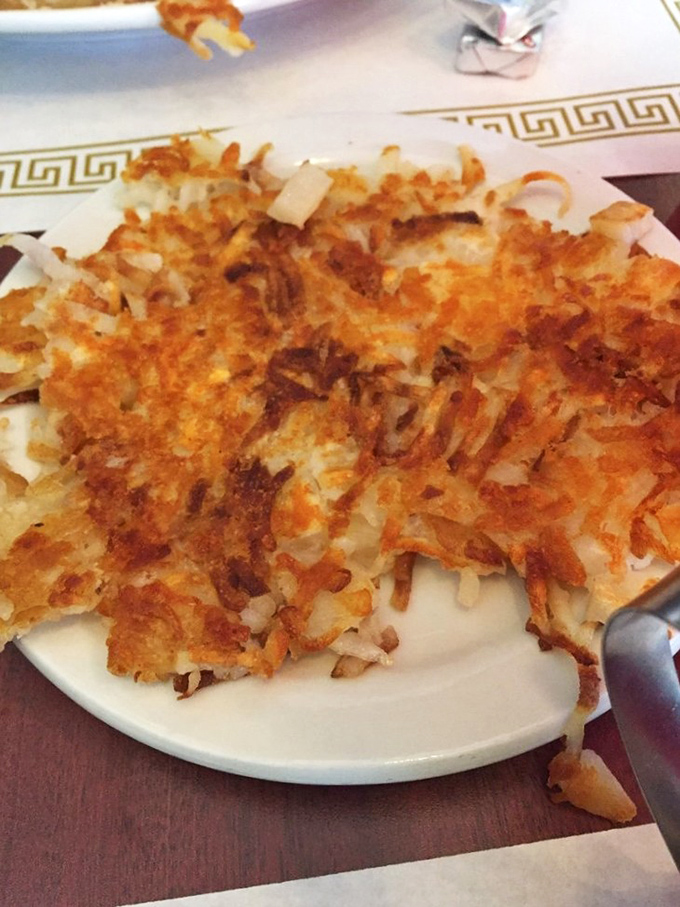 Hash browns achieving that mythical balance&mdash;golden-crisp exterior giving way to tender potato within. The breakfast equivalent of striking gold in the Old West.