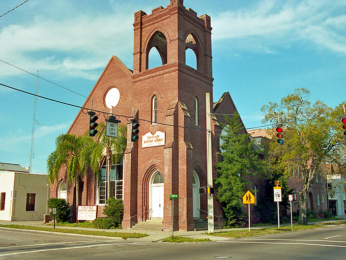 Heritage Baptist Church's Gothic brick tower reaches skyward, a red-brick spiritual lighthouse that's been guiding the community for generations.