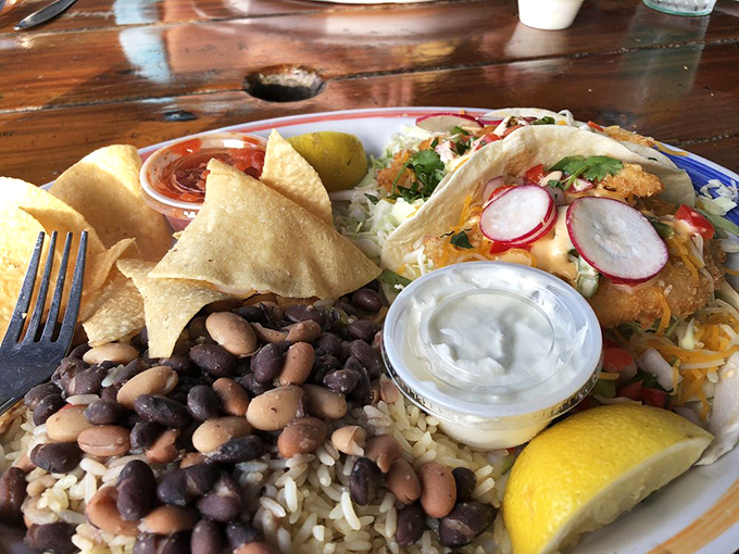 These fish tacos aren't just a meal; they're a vacation on a plate. The black beans and rice aren't sidekicks&mdash;they're co-stars in this Florida flavor blockbuster.