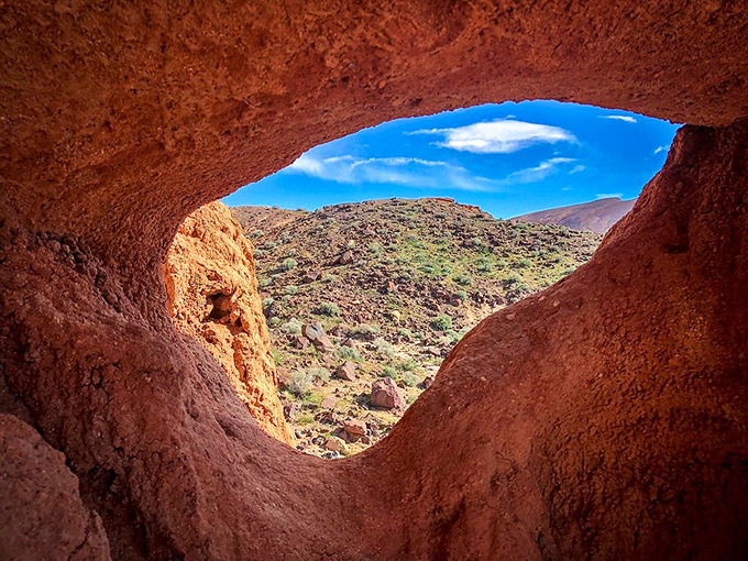 Desert peekaboo at its finest. Nature's perfect frame reveals a landscape that makes even the most jaded travelers stop and stare.