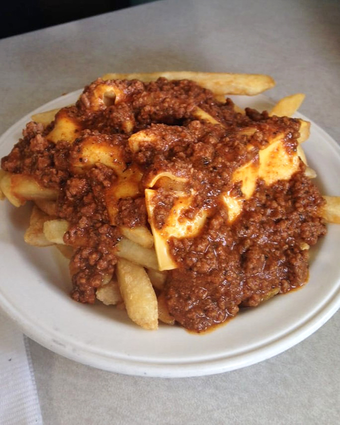 These aren't just home fries&mdash;they're a meaty masterpiece. Crispy potatoes smothered in savory ground beef sauce create the comfort food equivalent of a warm hug.