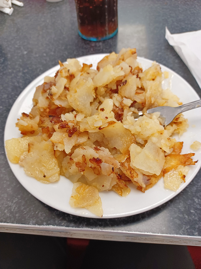 Home fries that have clearly taken sides in the great potato debate: crispy exteriors protecting tender insides, with just enough seasoning to declare victory.