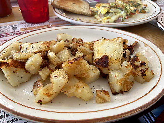 Home fries that achieve the impossible: crispy edges, tender centers, and seasoning that makes you wonder why potatoes elsewhere even try.