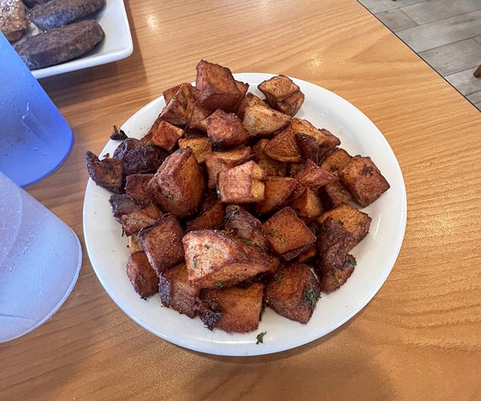 The legendary home fries in all their golden glory. These aren't just potatoes&mdash;they're little crispy cubes of breakfast perfection worth driving across state lines for.