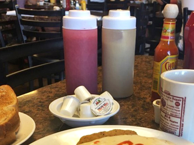 Those squeeze bottles aren't just condiment containers&mdash;they're flavor delivery systems, standing ready like breakfast superheroes waiting to be summoned.
