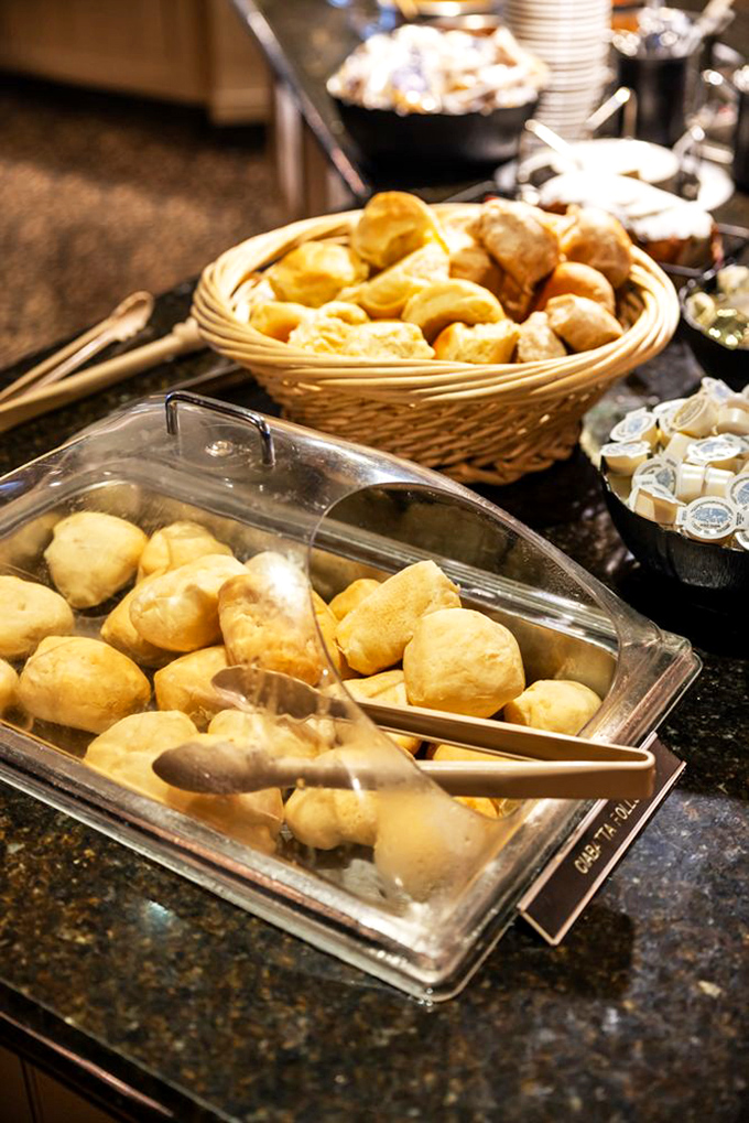 Fresh-baked rolls waiting to meet their destiny with a swipe of butter. These pillowy carb clouds are worth every minute on the treadmill tomorrow.