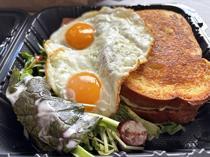 Two sunny-side-up eggs perched atop a garden of greens and toast &ndash; proof that breakfast can be both photogenic and life-changing.