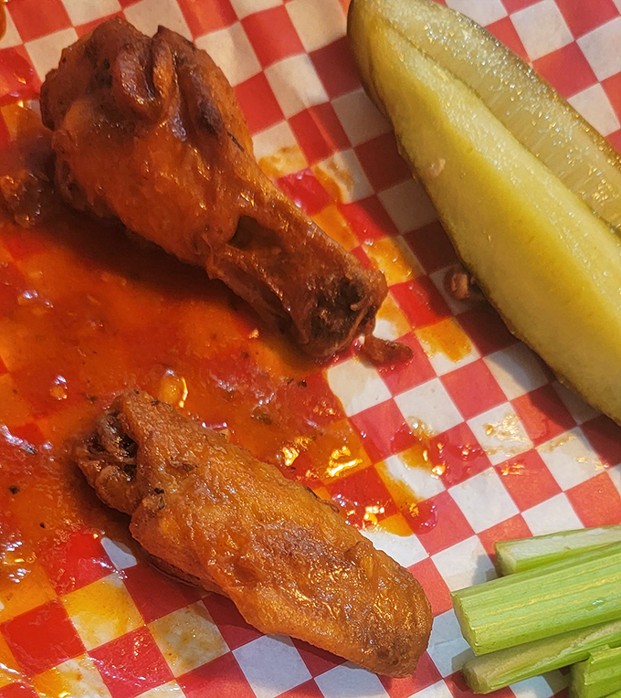 Buffalo wings with the perfect sauce-to-crunch ratio, served with the obligatory pickle and celery&mdash;nature's palate cleansers for serious wing business.