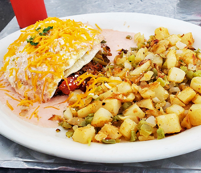 Potatoes that actually taste like potatoes, eggs smothered in cheese, and a portion that says "we want you to leave happy." Breakfast as it should be.
