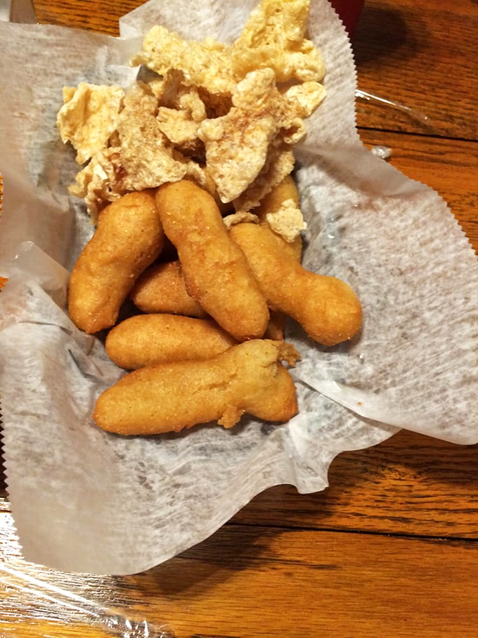 Golden-brown hush puppies and cracklins that crunch like nature's perfect soundtrack. Silence falls across the table when these arrive.