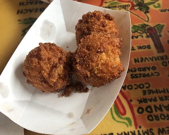 Hush puppies so perfectly golden they practically demand silence while you savor them. Crispy exterior, fluffy interior—the seafood sidekick of your dreams.