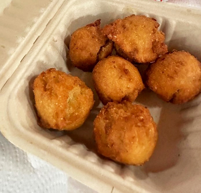 Golden hush puppies that crunch like your favorite childhood memories before melting into cornmeal perfection.