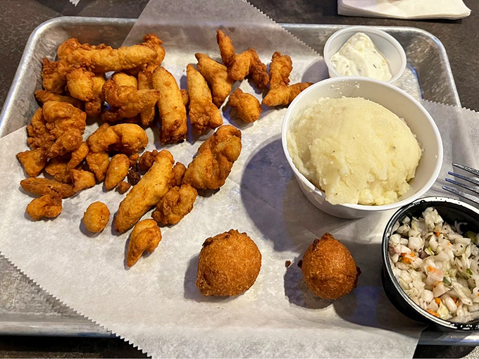 Golden-fried treasures from the deep &ndash; these bite-sized morsels of happiness come with creamy mashed potatoes and homemade coleslaw that grandma would approve of.