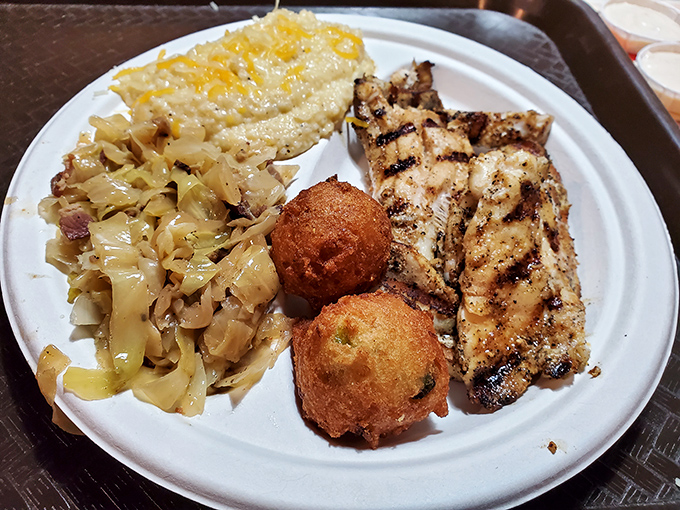 The holy trinity of Southern seafood dining: perfectly grilled fish, tangy coleslaw, and hushpuppies that would make your grandmother weep with joy.