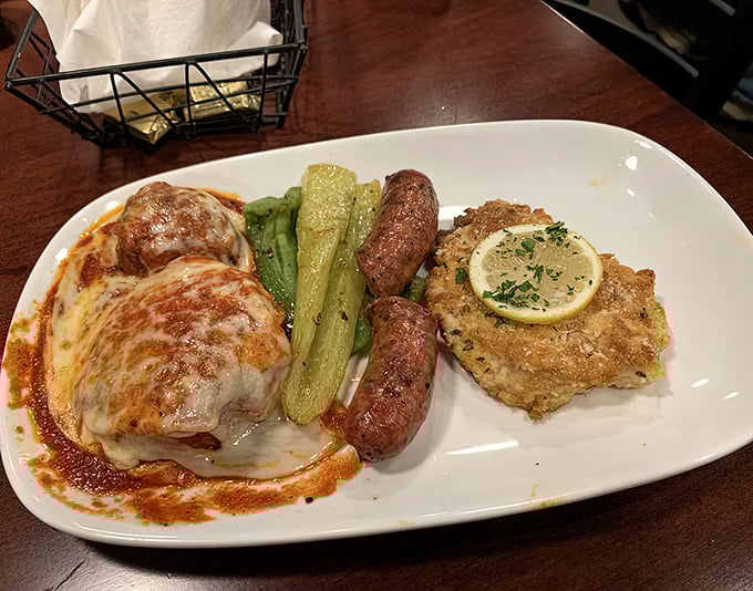 A feast for the indecisive: chicken parmesan, Italian sausage, and veal piccata share a plate with perfectly cooked vegetables&mdash;the Italian version of "having it all."