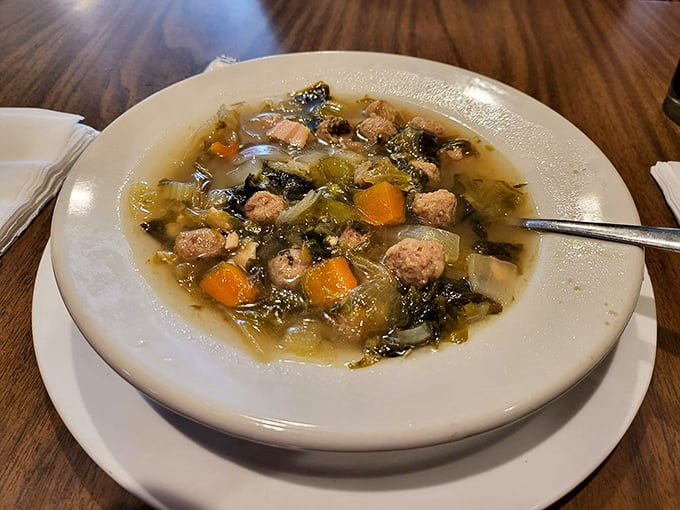 Italian Wedding Soup that would make any nonna proud &ndash; tiny meatballs swimming alongside vegetables in a broth that tastes like someone's been stirring it with love all day.