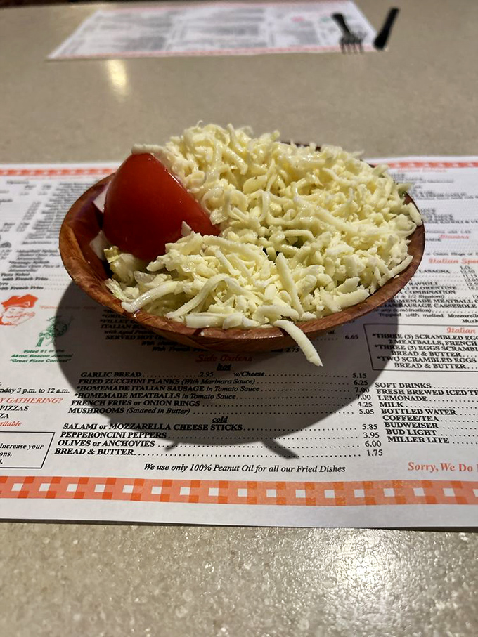 The Italian salad might look simple, but that mountain of cheese and fresh tomato creates the perfect opening act for pizza night.