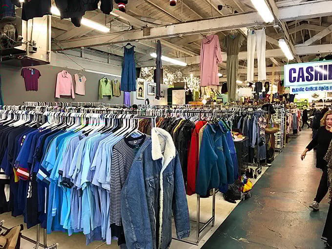 The blue shirt section alone could outfit a small navy. Note the strategic hanging of dresses overhead&mdash;vintage shopping in three dimensions.