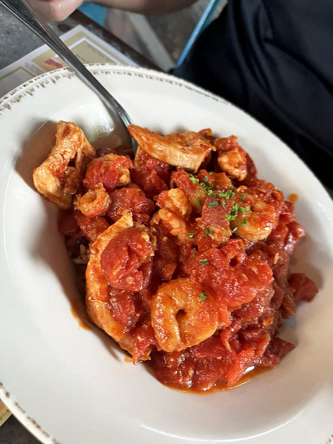 Jambalaya that would make New Orleans jealous &ndash; chunks of seafood and chicken swimming in a tomato bath that's been simmering since breakfast.