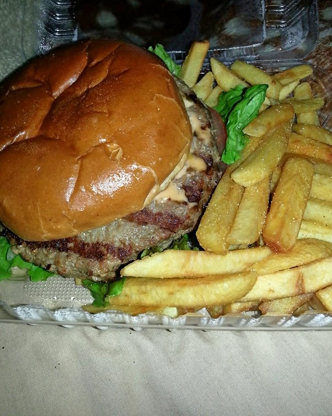 John's signature creation: a burger so legendary it practically comes with its own fan club. 