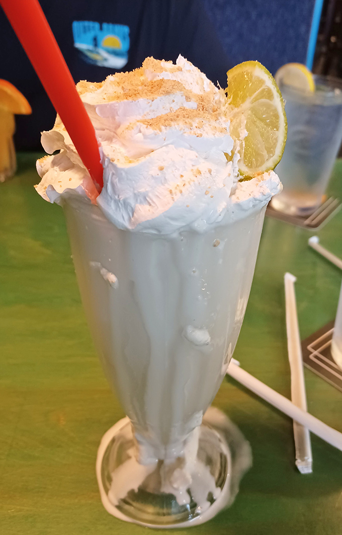 Not your grandma's milkshake! This towering key lime creation topped with whipped cream and graham cracker crumbs is dessert with a straw.