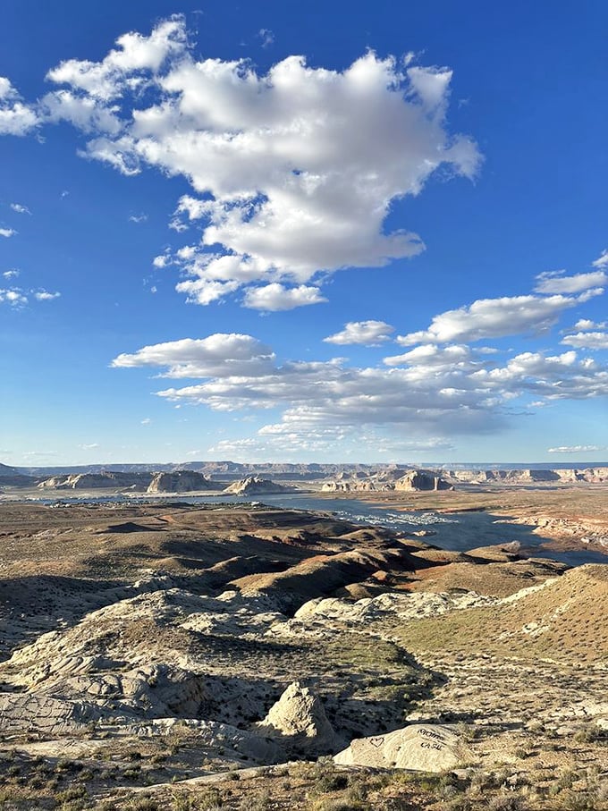 Heaven might look something like this. Scattered clouds create a perfect canvas above Lake Powell's serpentine waterways cutting through ancient stone.