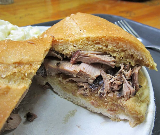 The lamb sandwich reveals its secrets: tender meat nestled in bread that's achieved the perfect balance between crisp exterior and jus-soaked interior.