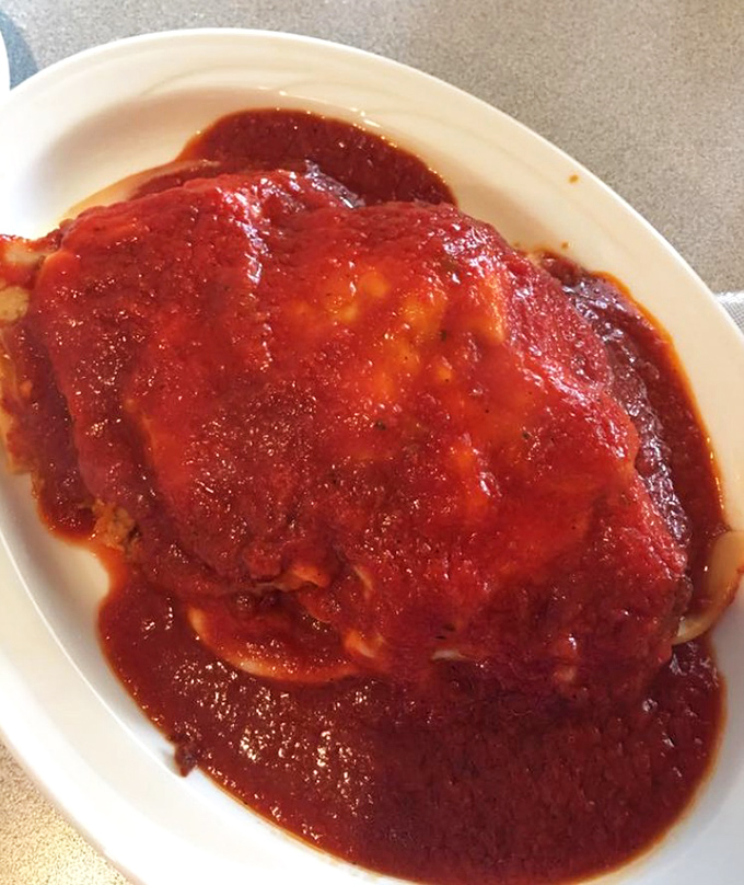 Lasagna that doesn't know the meaning of restraint – layers of pasta, cheese, and sauce in a relationship that would make therapists jealous.