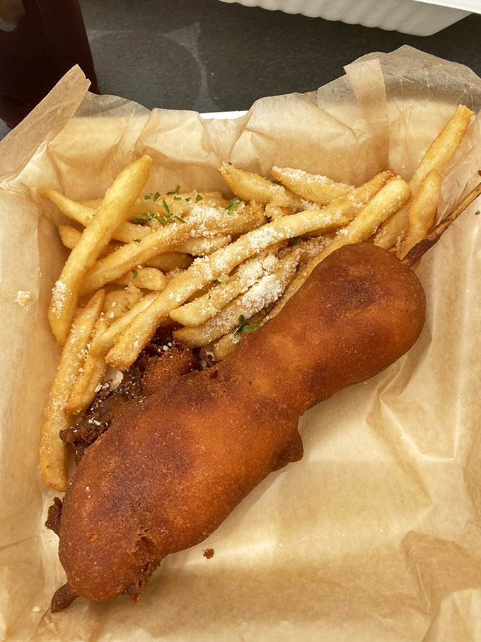 The lobster corn dog proves that sometimes the best culinary ideas are born when fancy meets fun on the same plate.