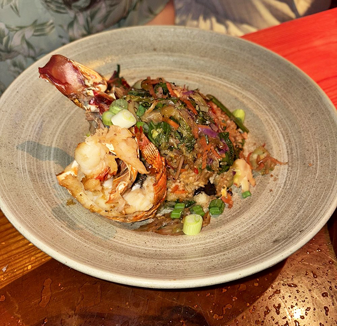 This isn't just lobster fried rice&mdash;it's a seafood celebration where each grain has been personally introduced to perfectly cooked crustacean and vibrant vegetables.