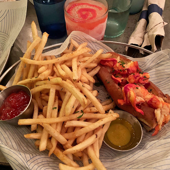 The perfect lobster roll doesn't exi&mdash; Oh wait, here it is! Buttery, overflowing, and demanding to be photographed before it disappears.