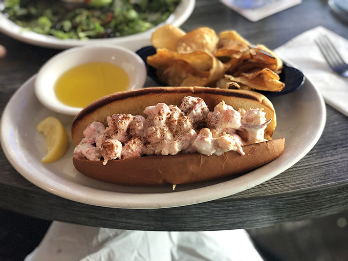 The legendary lobster roll – chunks of sweet meat nestled in a buttery toasted bun with just enough dressing to enhance, never overwhelm, the star attraction.