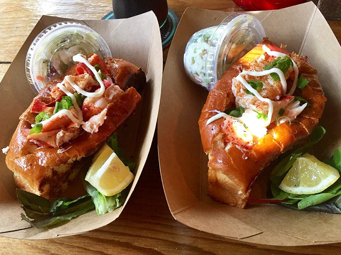 Two lobster rolls having a heart-to-heart conversation about why they're the best thing that ever happened to bread. Spoiler alert: they're right.
