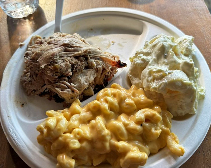 Mac and cheese that actually tastes like both mac AND cheese, alongside meat that's had a proper smoke-induced spa day. Comfort food nirvana achieved.