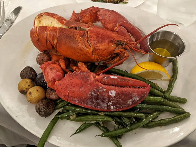 This steamed Maine lobster isn't just dinner &ndash; it's an event, complete with potatoes, green beans, and that little cup of liquid gold.