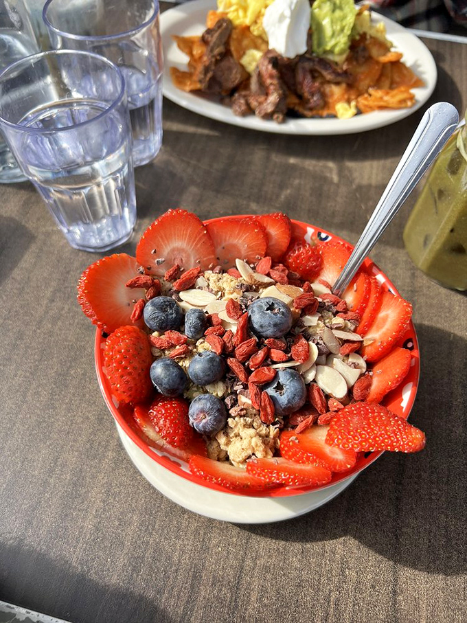 Nature's candy store in a bowl&mdash;where strawberries, blueberries, and granola create a breakfast symphony that makes your morning playlist jealous.
