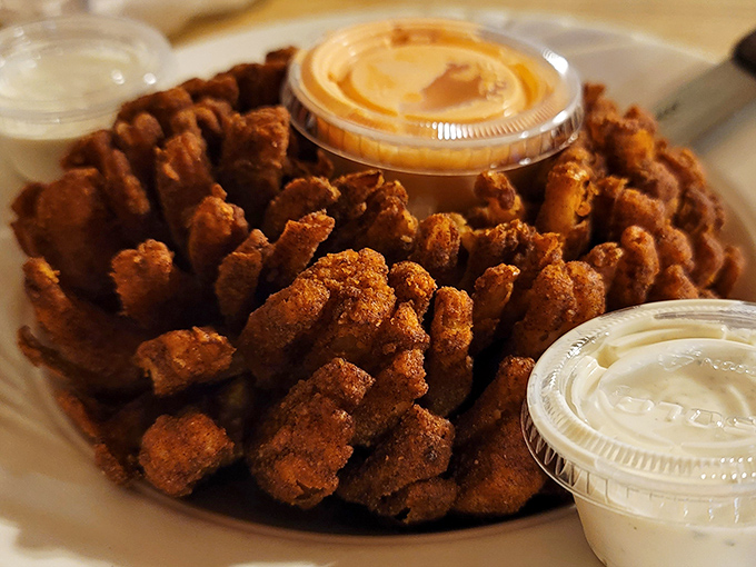 The Mayflower Onion isn't just an appetizer&mdash;it's a crispy, golden flower that blooms right on your plate, begging for a dip.