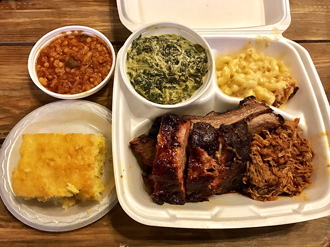 The barbecue sampler that answers the eternal question: "Why choose one meat when you can have them all?" Side dishes fighting for attention.
