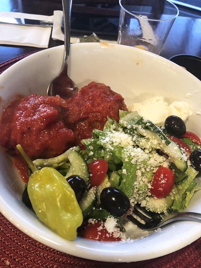 Who says salad can't be exciting? Those meatballs are the headliners, with fresh greens and olives playing the delicious supporting roles.