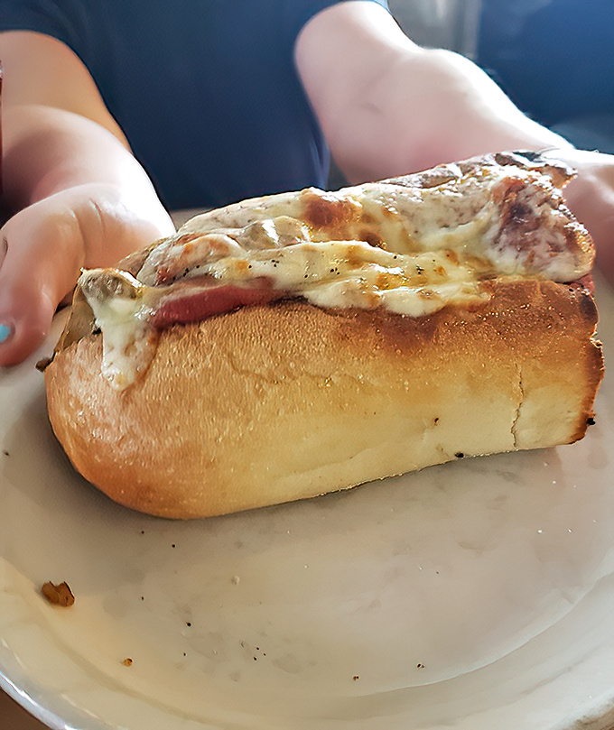 That's not just melted cheese you're looking at&mdash;it's a lava flow of dairy goodness threatening to erupt from a perfectly toasted submarine of carb-loaded bliss.