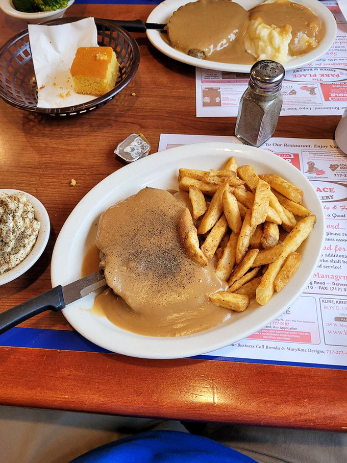 Tender meatloaf swimming in rich gravy proves that some classics never go out of style.