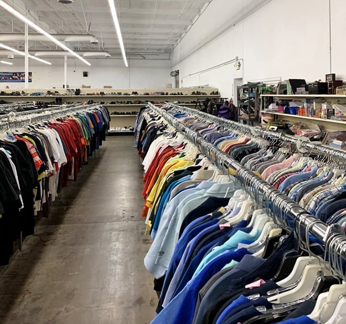 The men's section: where dress shirts line up with military precision, ready for their second act in your professional wardrobe.