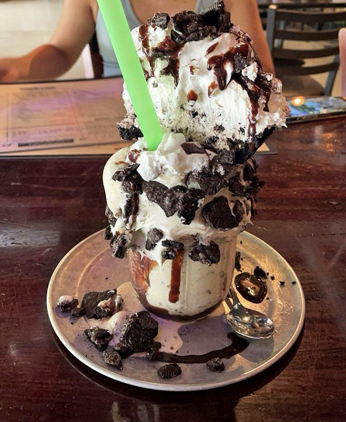 This isn't just a milkshake&mdash;it's architecture. Cookies and cream stacked so high it needs building permits, with chocolate sauce as structural support.