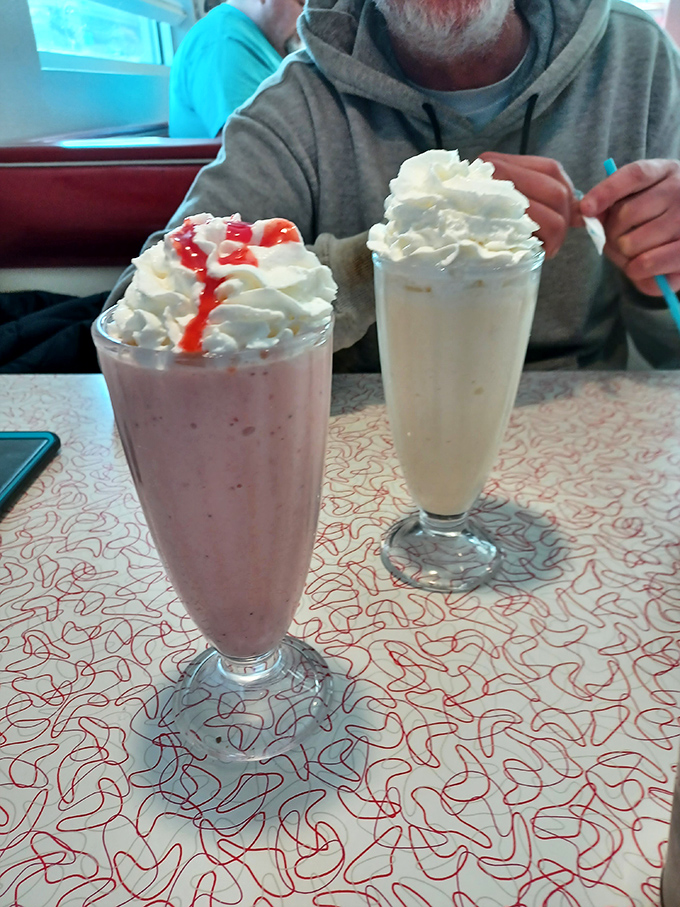 These aren't just milkshakes&mdash;they're desserts masquerading as beverages. The strawberry version comes with its own red carpet of syrup.