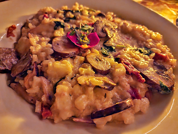 Mushroom risotto that's dressed for a special occasion, complete with an edible flower corsage. Creamy, earthy, and ready for its close-up.