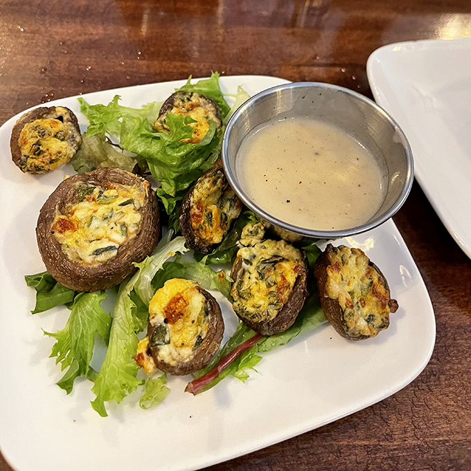 These aren't just stuffed mushrooms &ndash; they're little umami bombs of joy. The dipping sauce isn't necessary, but neither was the Sistine Chapel ceiling.