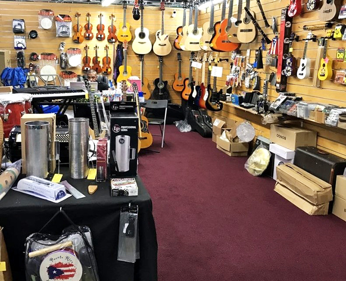 A musician's paradise where guitars hang like exotic fruit, waiting to be plucked. Each instrument holds melodies and stories yet to be played.